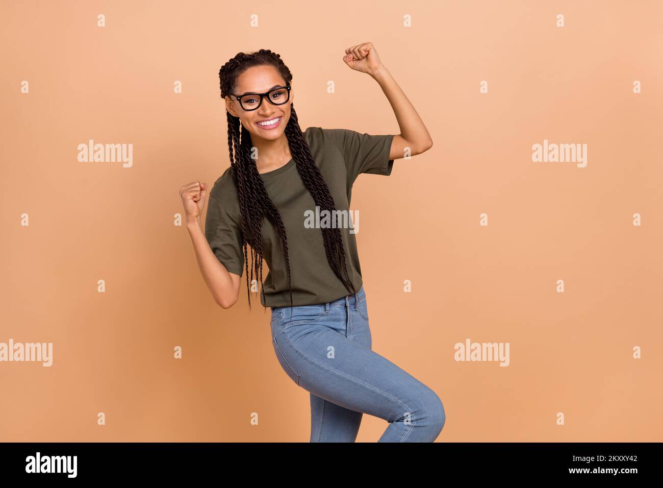 Photo of delighted overjoyed girl raise fists celebrate triumph luck ...