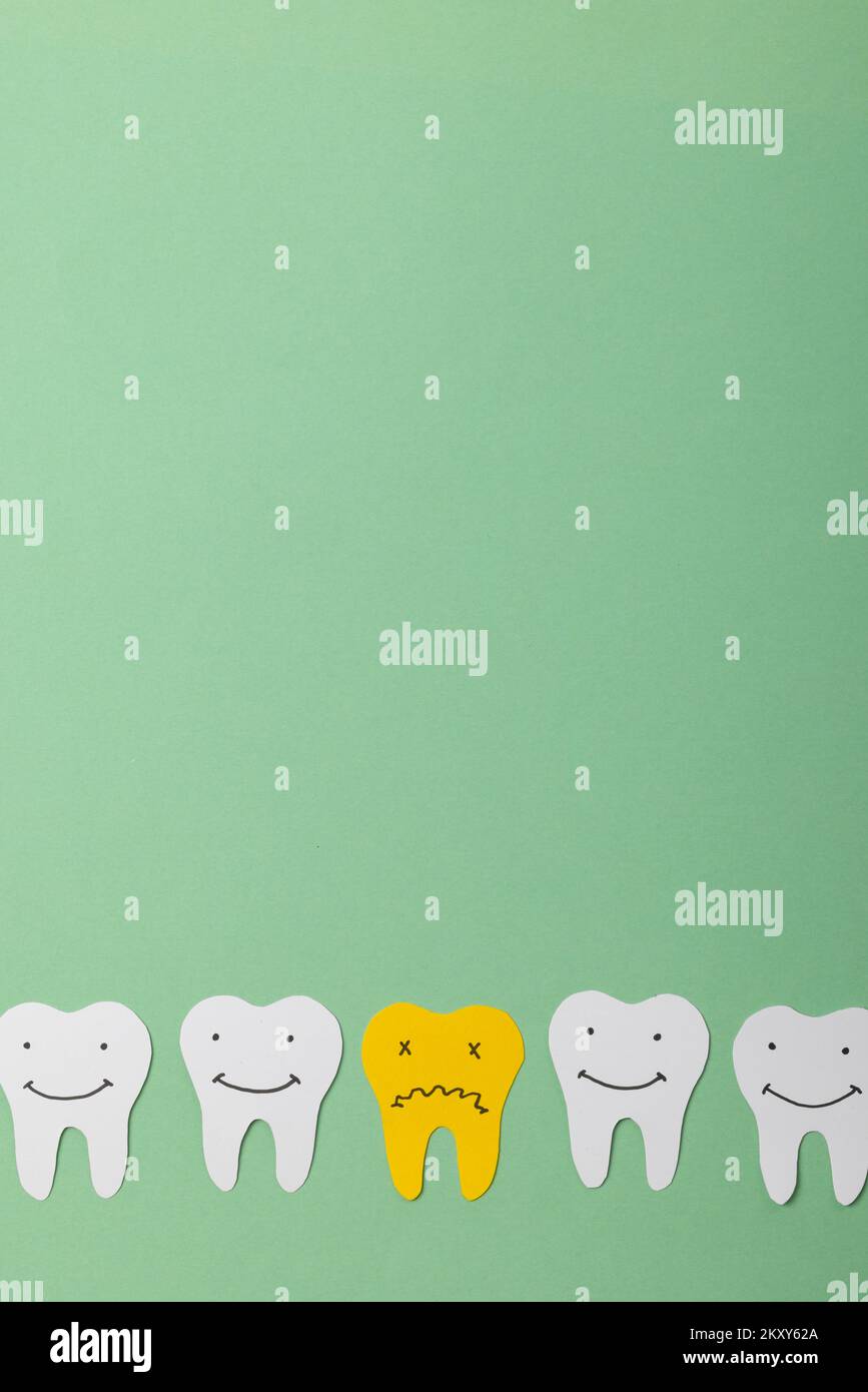 Close up of paper teeth on green background with copy space Stock Photo ...
