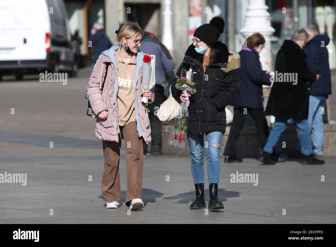 Woman holding a flower as International Women's Day gifts, in Zagreb ...