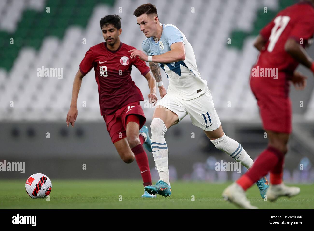 Benjamin Sesko of Slovenia in action against Naif Al Hadhrami of Qatar ...