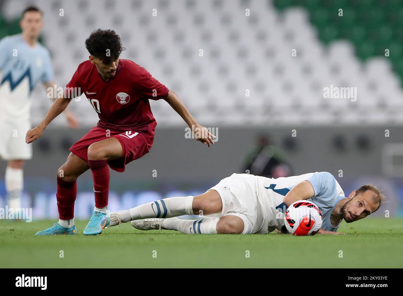 Khalid Muneer Ali of Qatar is challenged by Tomi Horvat of Slovenia ...