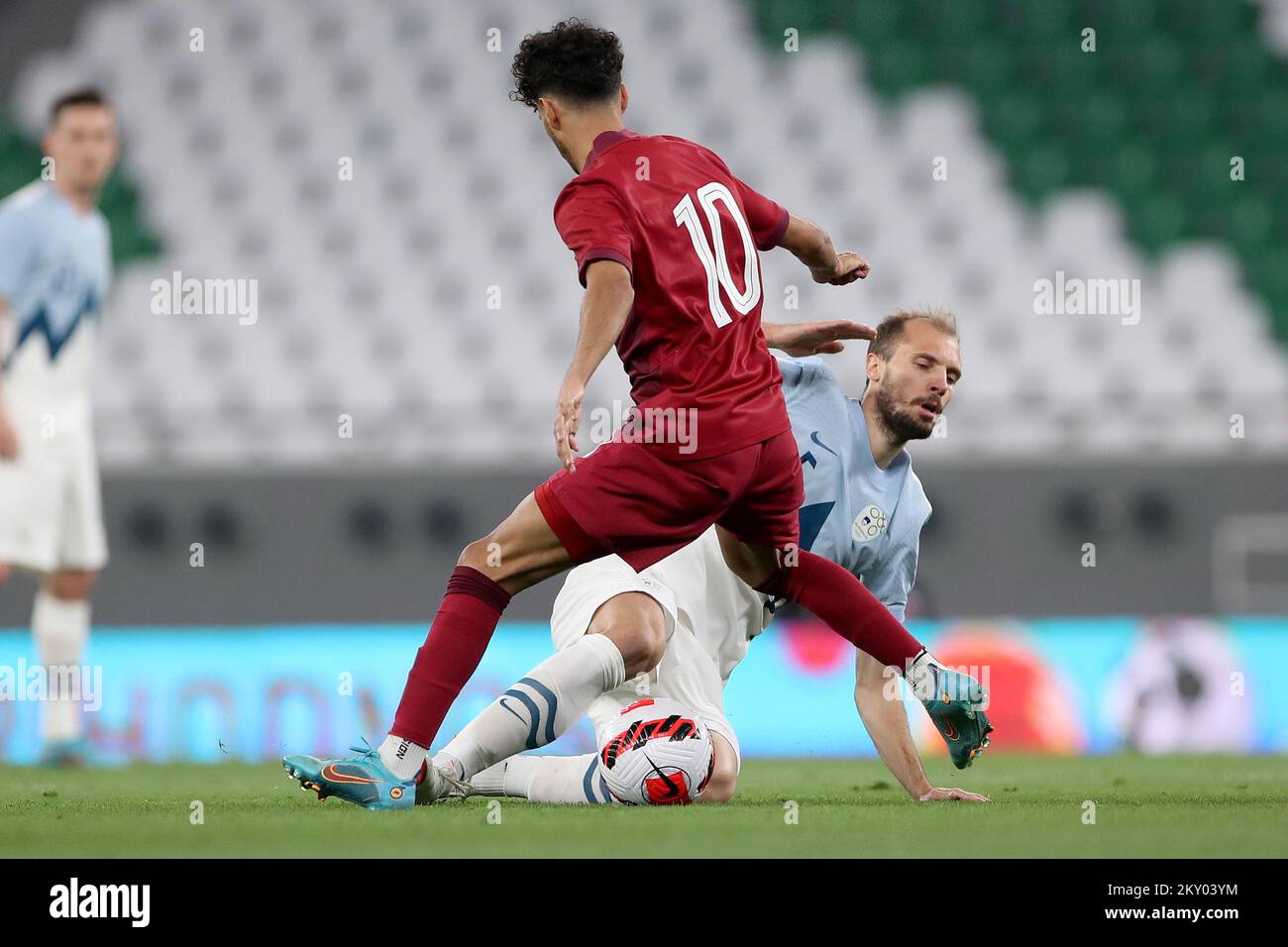 Khalid Muneer Ali of Qatar is challenged by Tomi Horvat of Slovenia ...