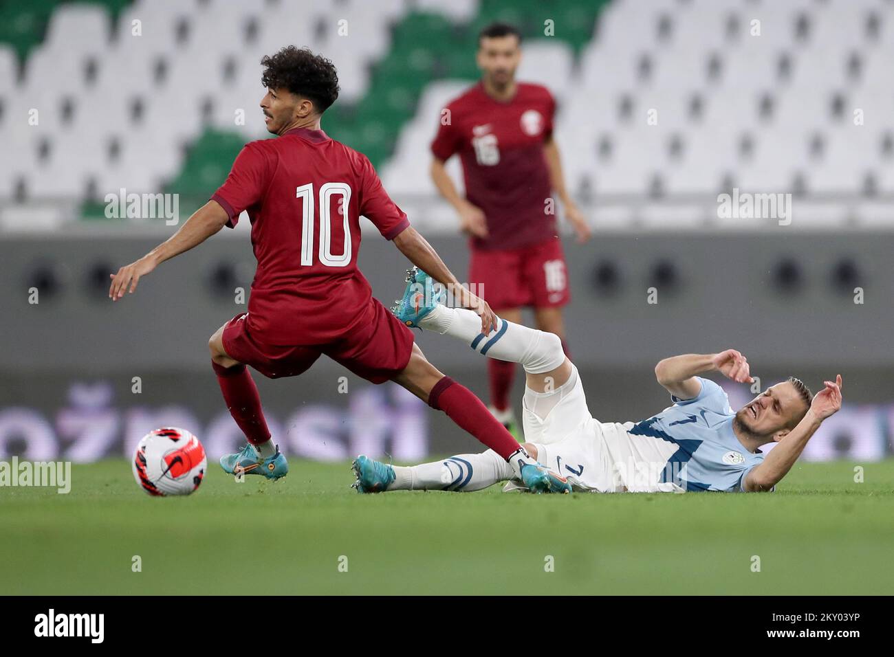 Khalid Muneer Ali of Qatar is challenged by Tomi Horvat of Slovenia ...