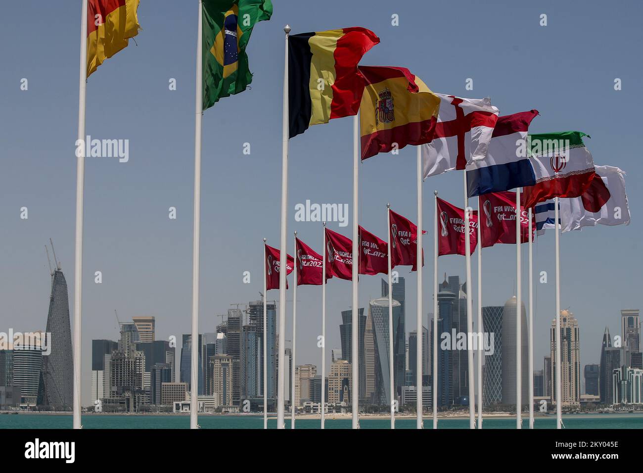Flags from countries qualified for the World Cup are seen on the coast ...