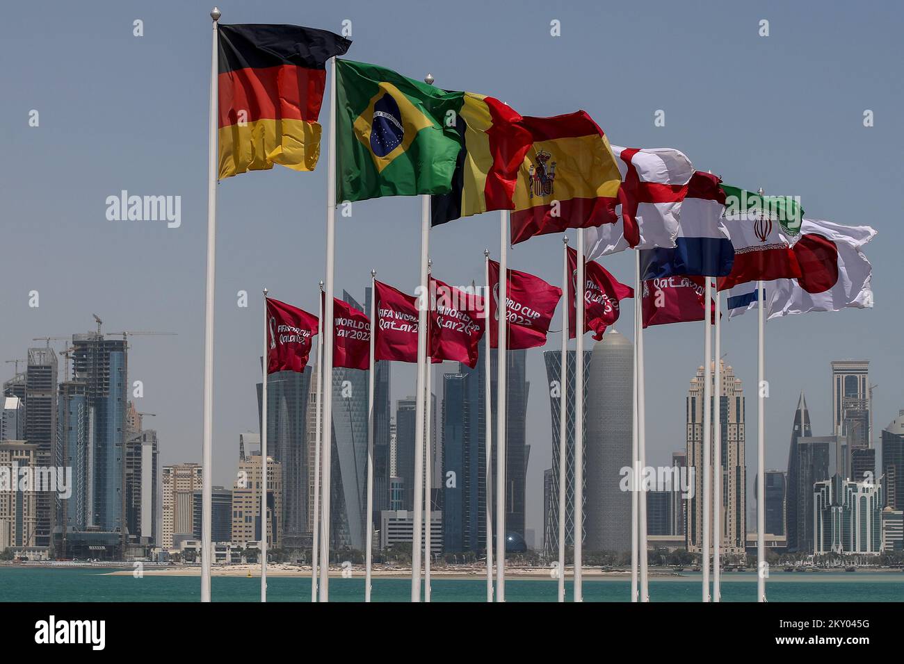 Flags from countries qualified for the World Cup are seen on the coast ...