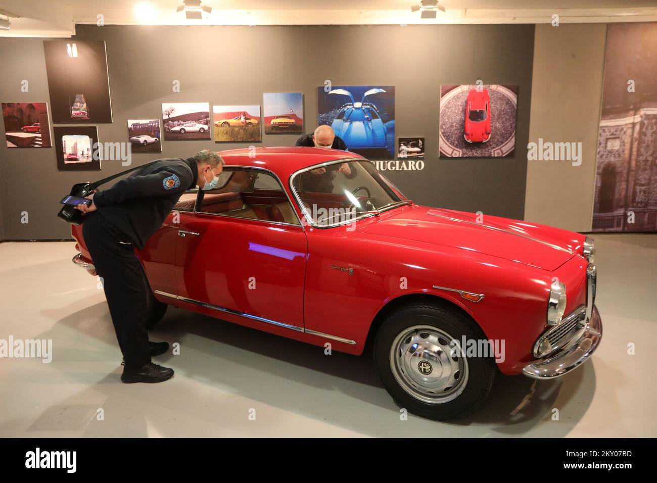 A man looks into 1980 Ferrari 308 GTR is pictured during La Grande ...