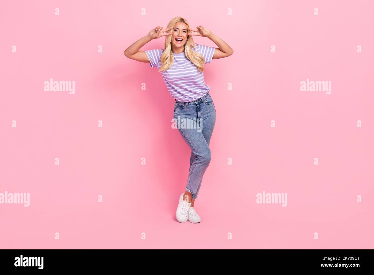 Full length photo of cheerful glad person toothy smile demonstrate v ...