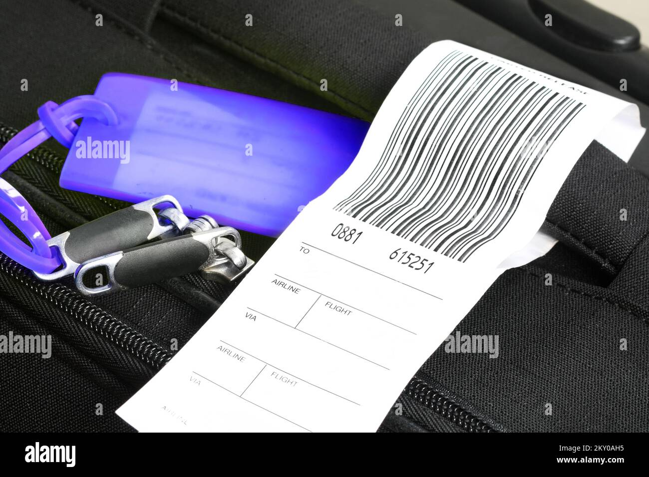 Traveling suitcase with checkin label (manual focus Stock Photo - Alamy