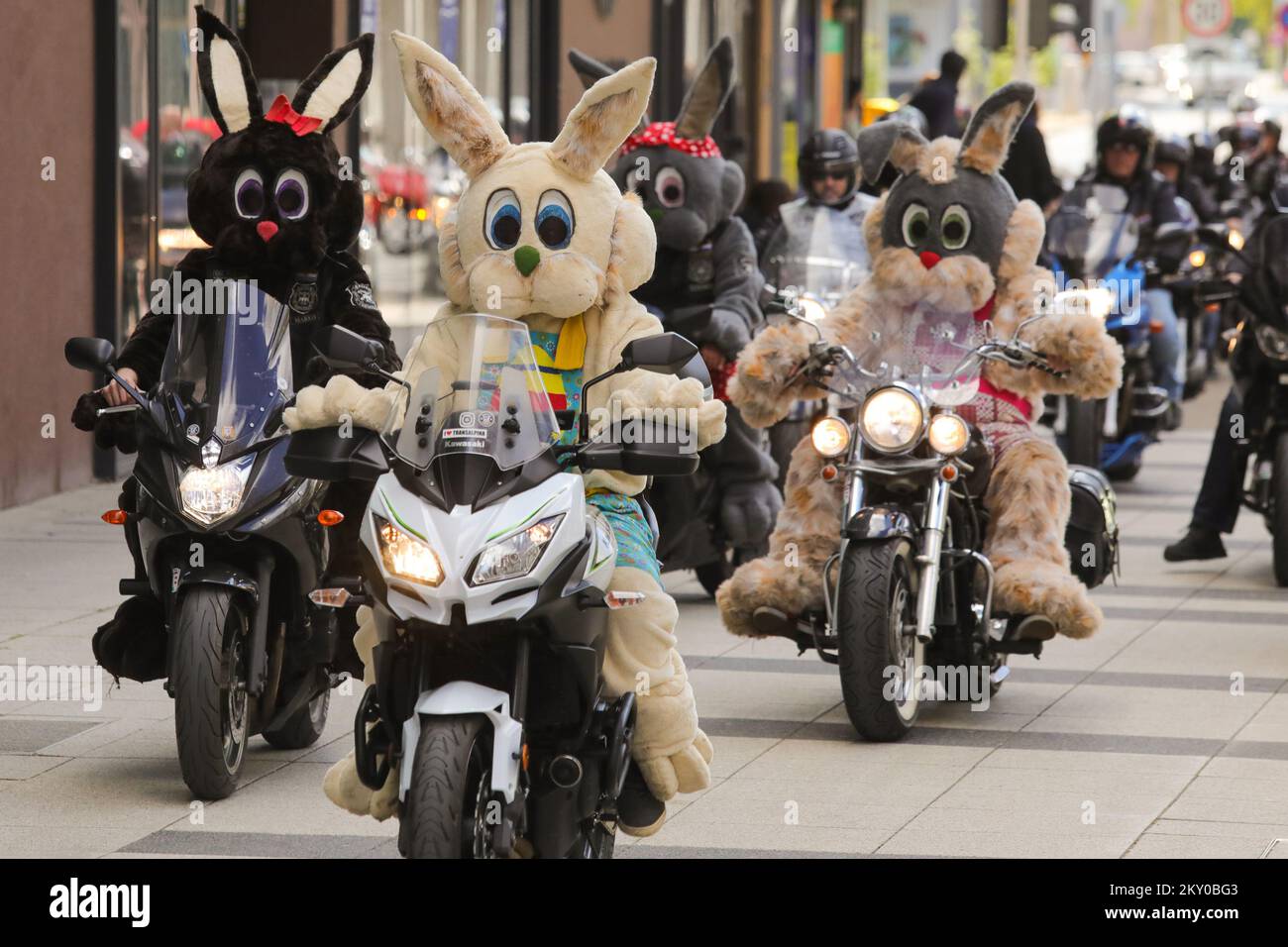 People dressed as the Easter Bunnies ride motorbikes during Easter Moto ...