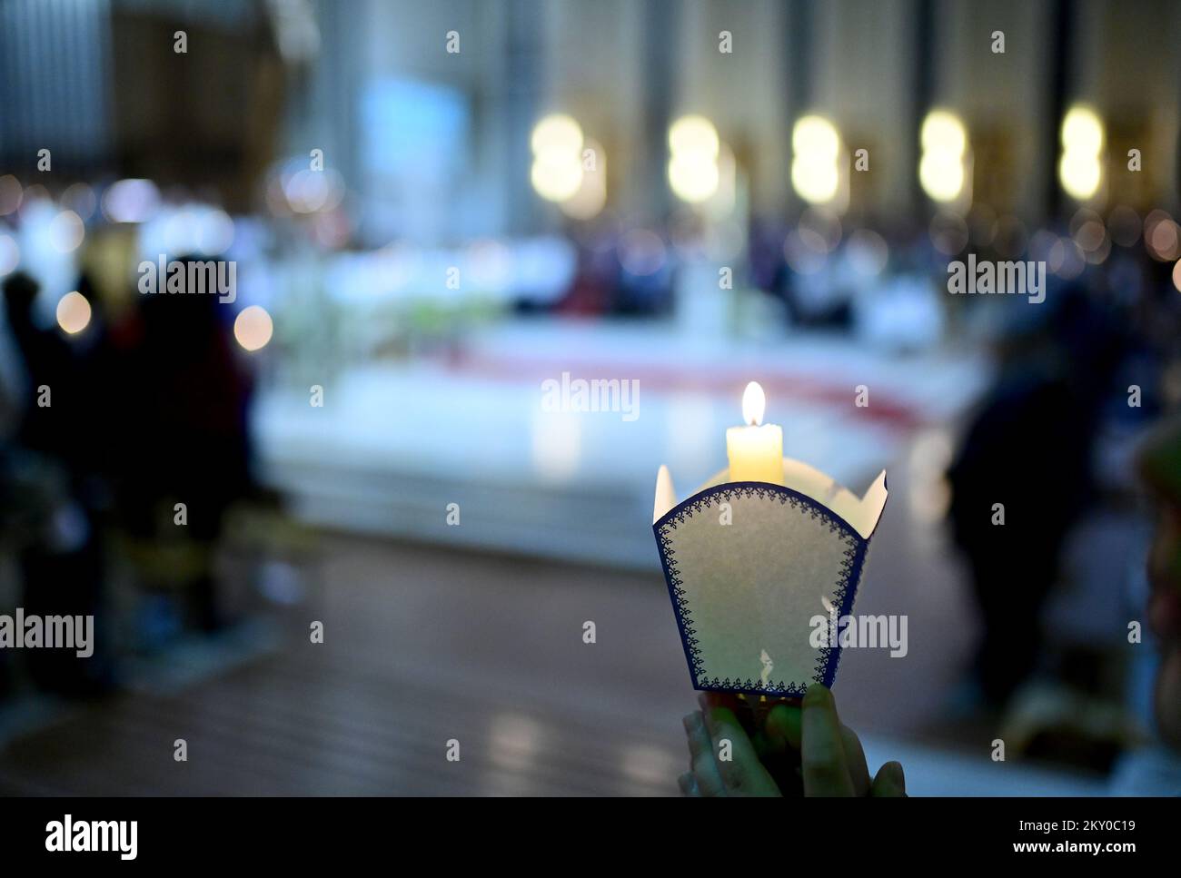 Candles are carried during Catholic procession as part of the holy fire ...