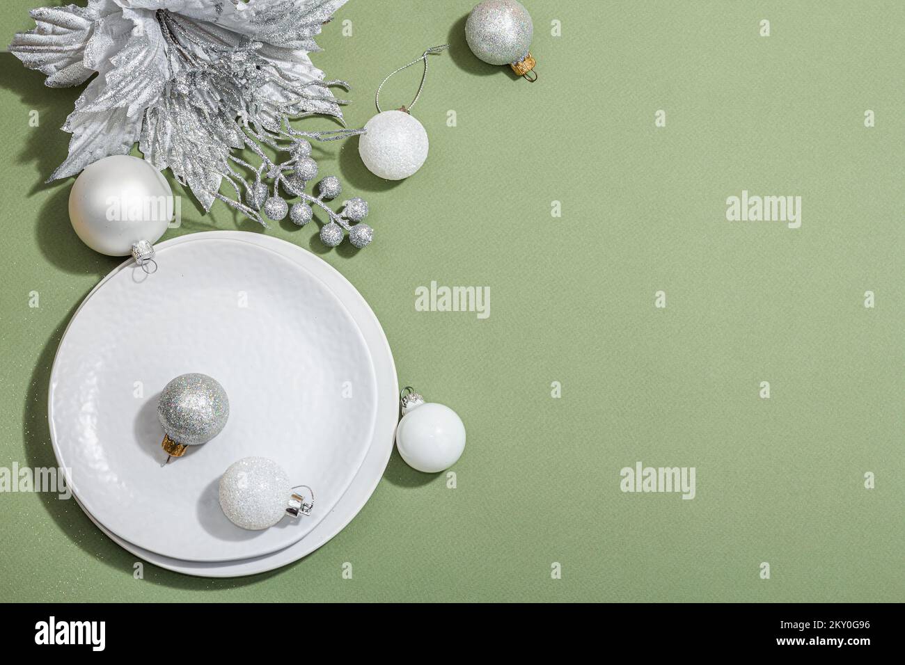 Christmas table setting with empty ceramic plates, traditional ...