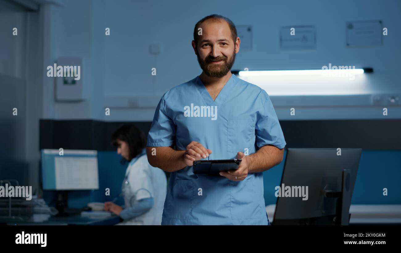 Physician nurse holding tablet computer checking patient diagnosis ...