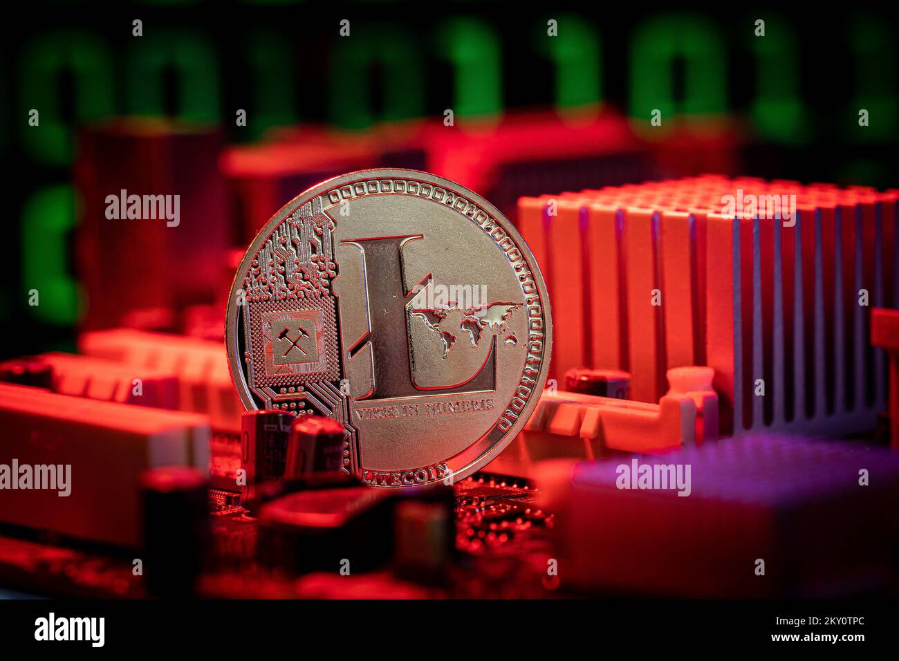 Physical Litecoin replica is seen on a computer motherboard. Photo ...