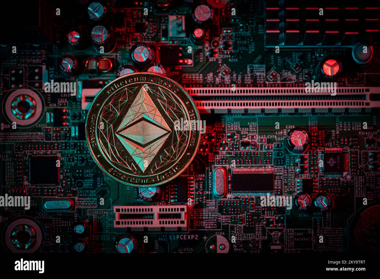 Physical Ethereum replica is seen on a computer motherboard. Photo ...
