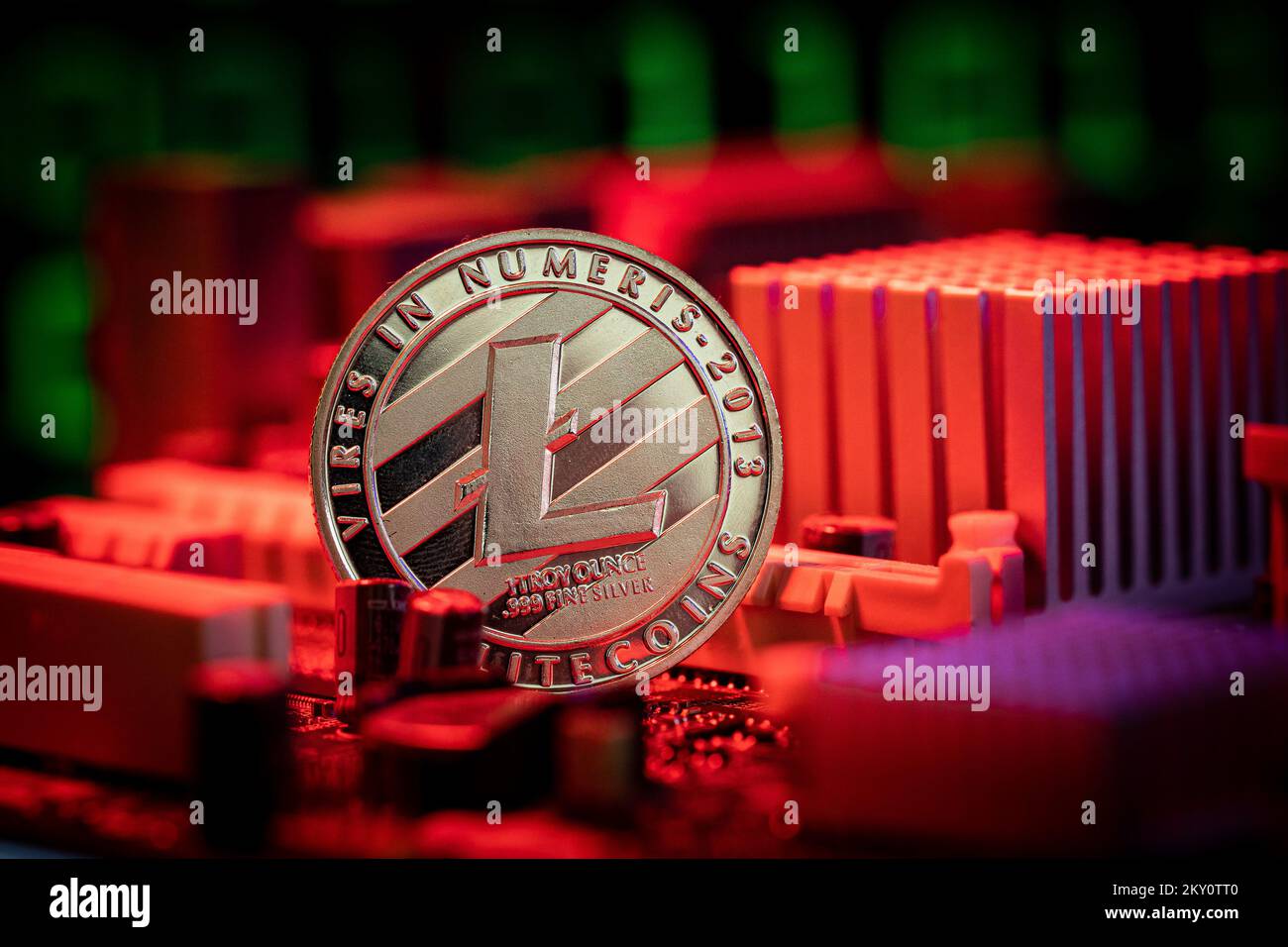 Physical Litecoin replica is seen on a computer motherboard. Photo ...
