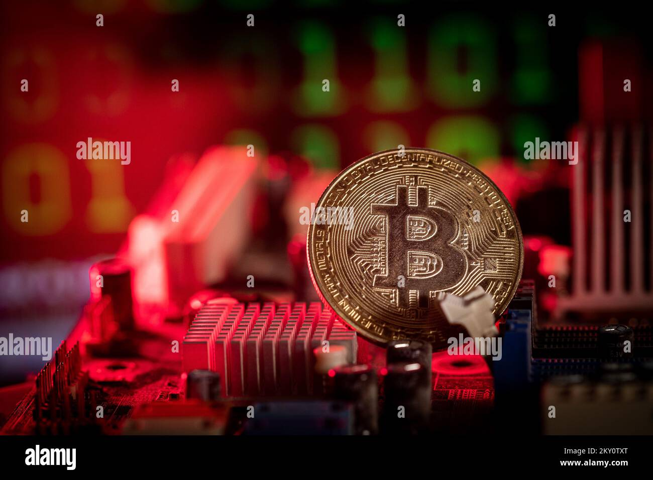 Physical Bitcoin replica is seen on a computer motherboard as smoke ...