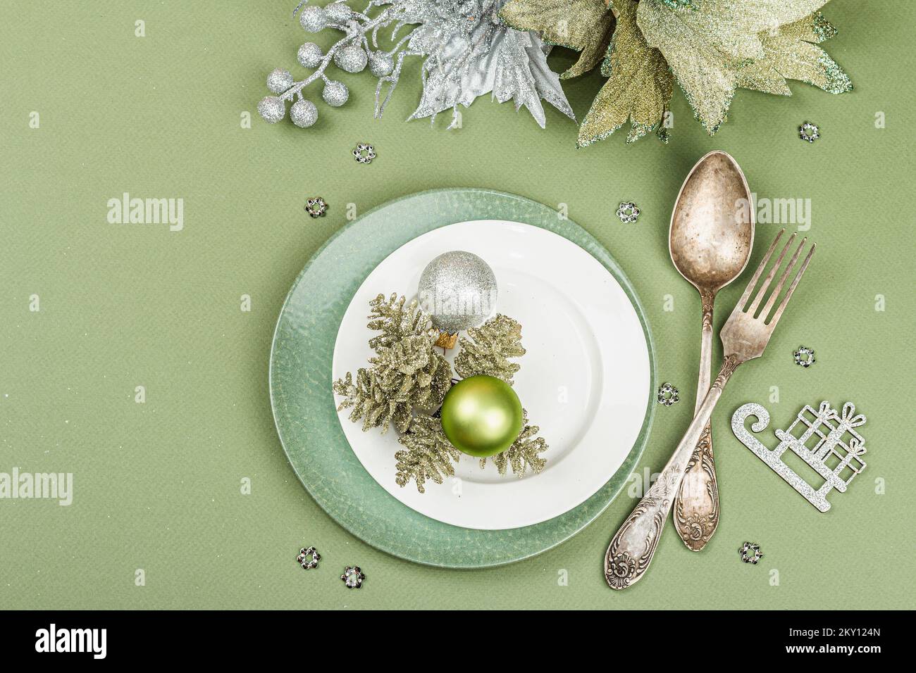 Christmas table setting with empty ceramic plates, traditional ...