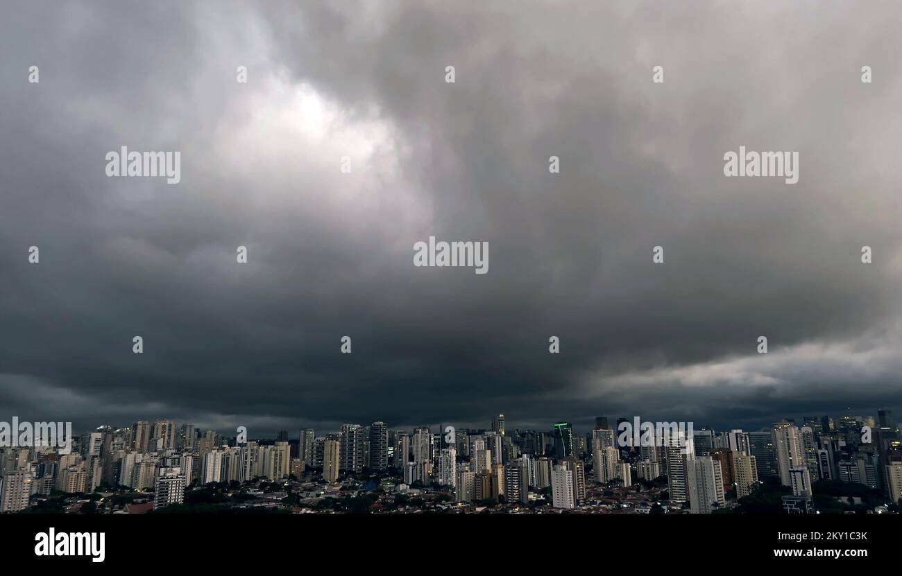 Dark and dramatic rain clouds over a city Stock Photo - Alamy