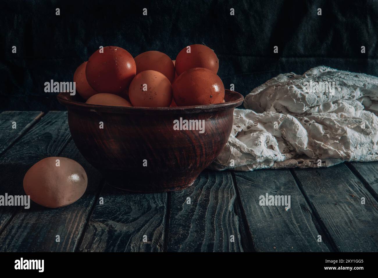 Chicken eggs in a clay plate on the table Stock Photo - Alamy