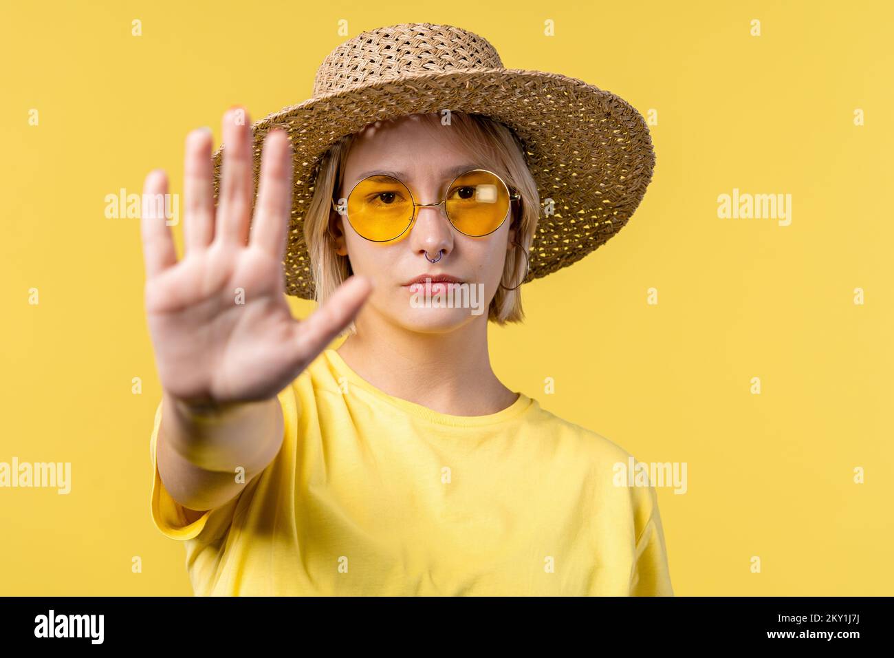 Uninterested woman disapproving with NO hand sign gesture. Denying ...