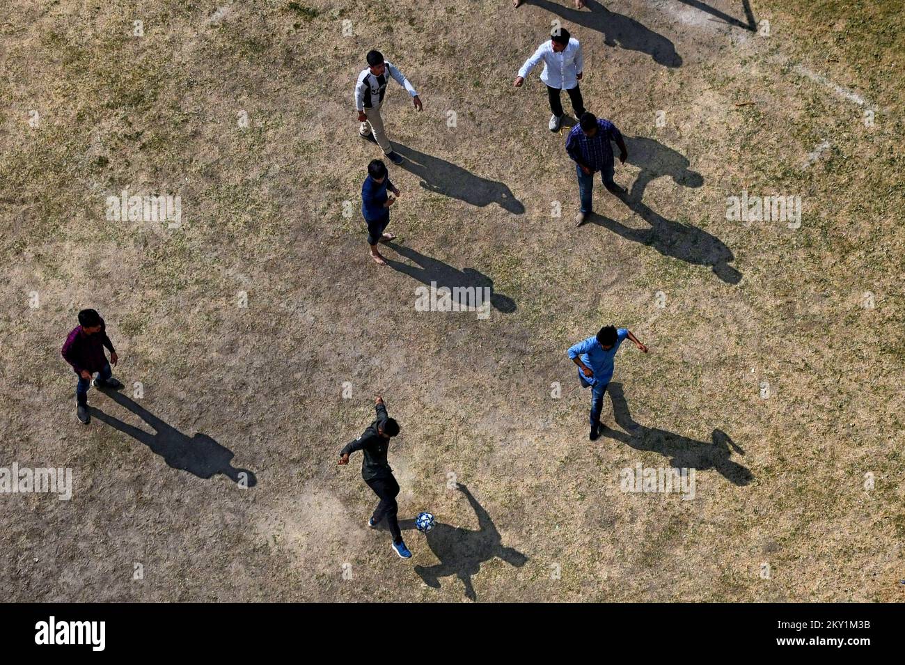 Young boys seen playing football at an open ground at Saltlake City ...