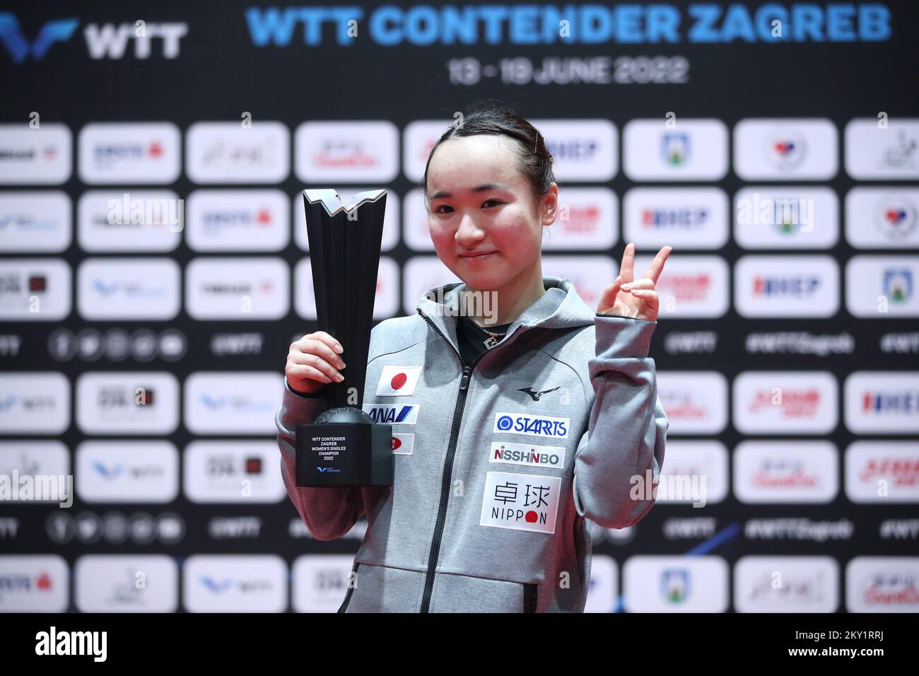 Winner Mima Ito of Japan pose with her trophy seen during medal award ...