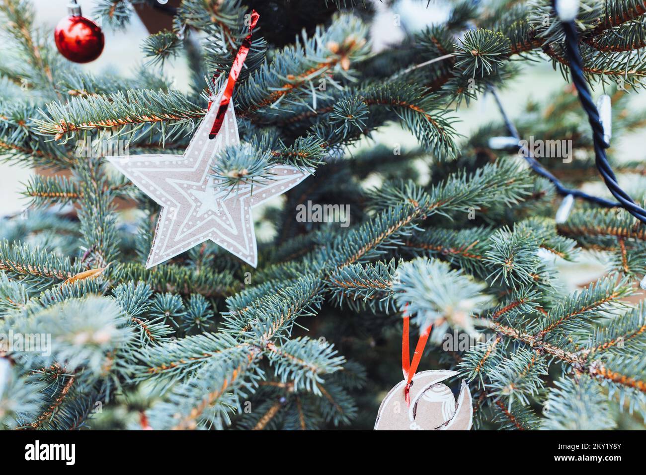 Handmade brown cardboard paper Christmas star decorations on Christmas ...