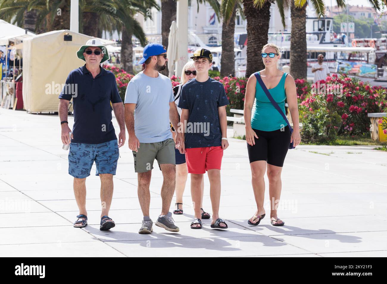 People walking along the Riva , Split's famous waterfront promenade ...