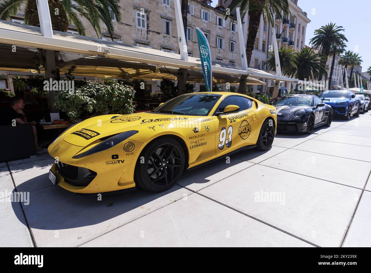 OneLife Rally cars attract the attention of passers-by along the ...