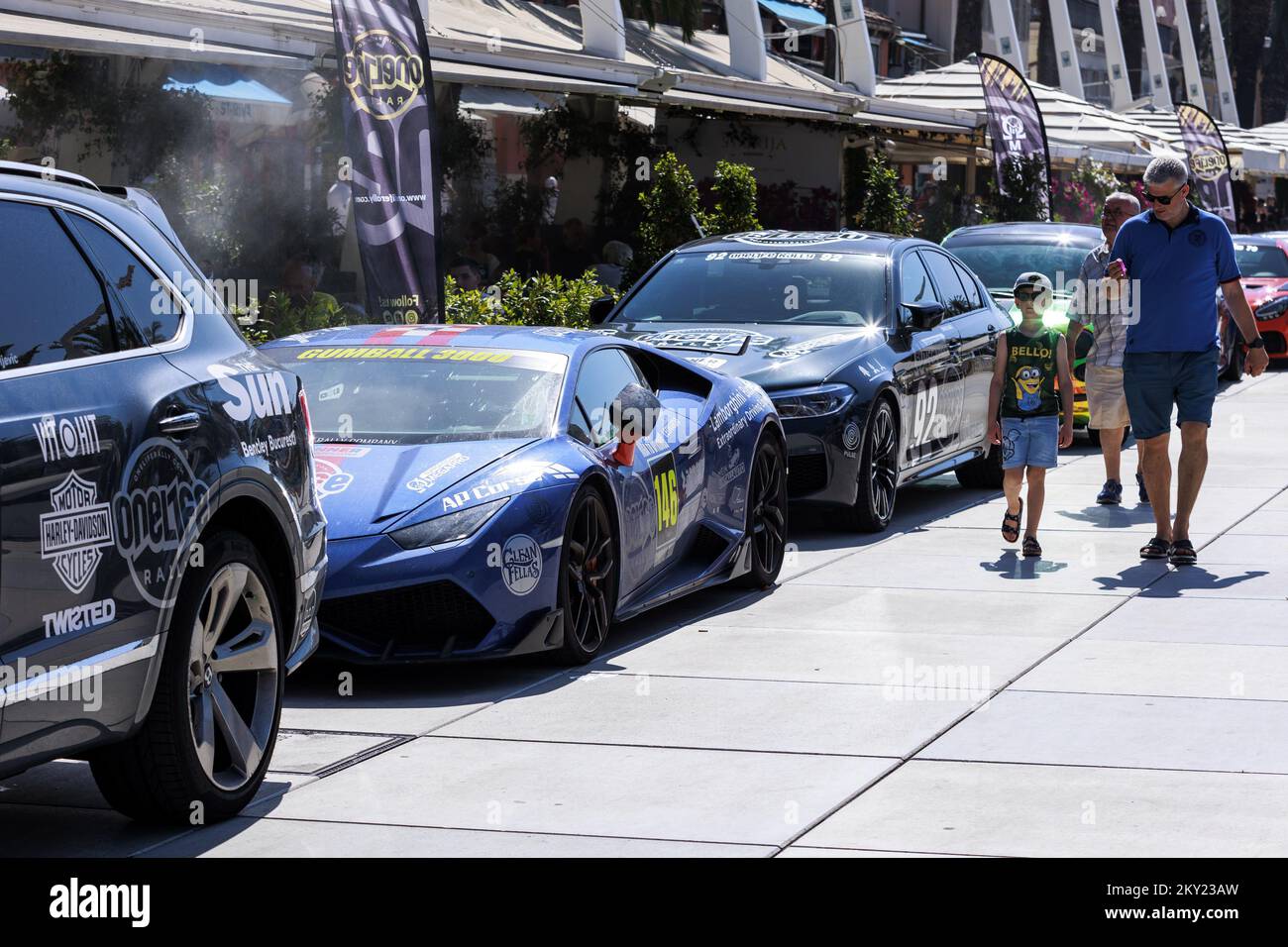 OneLife Rally cars attract the attention of passers-by along the ...
