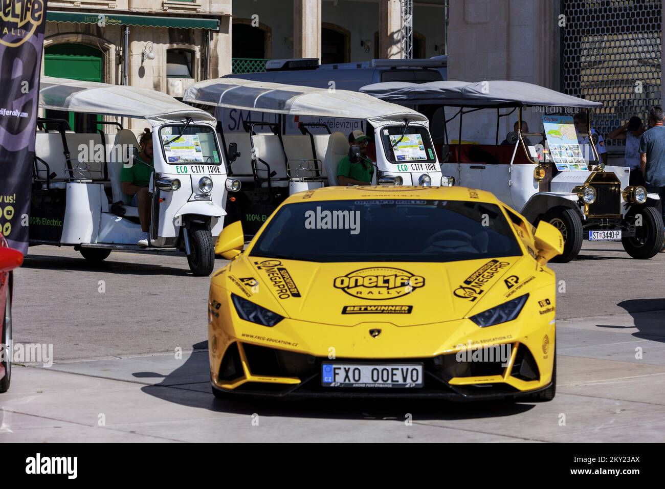 OneLife Rally cars attract the attention of passers-by along the ...