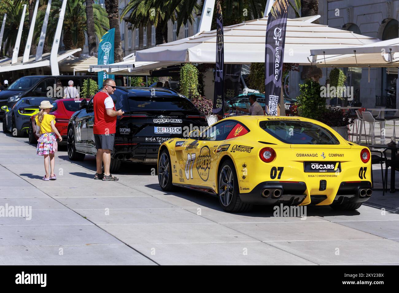 OneLife Rally cars attract the attention of passers-by along the ...