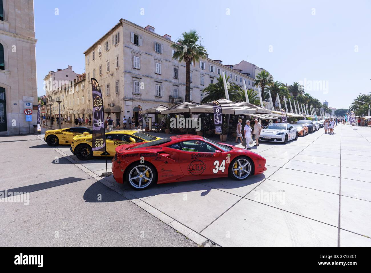 OneLife Rally cars attract the attention of passers-by along the ...