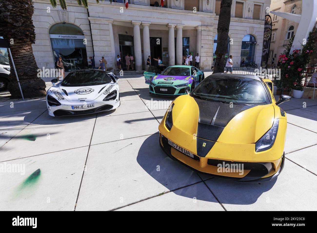 OneLife Rally cars attract the attention of passers-by along the ...