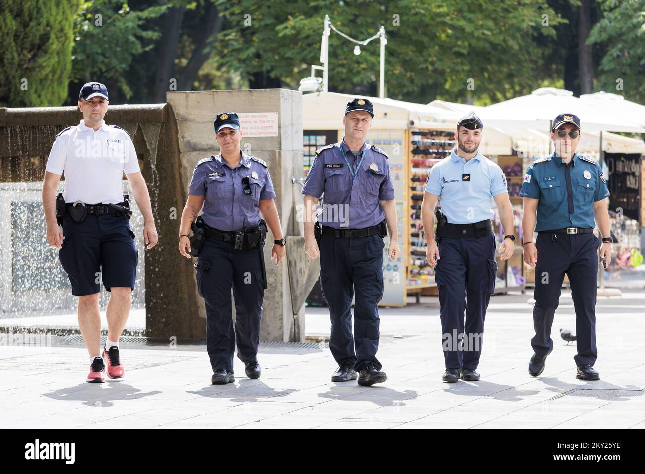 Croatian police officers walk with their colleagues from other ...