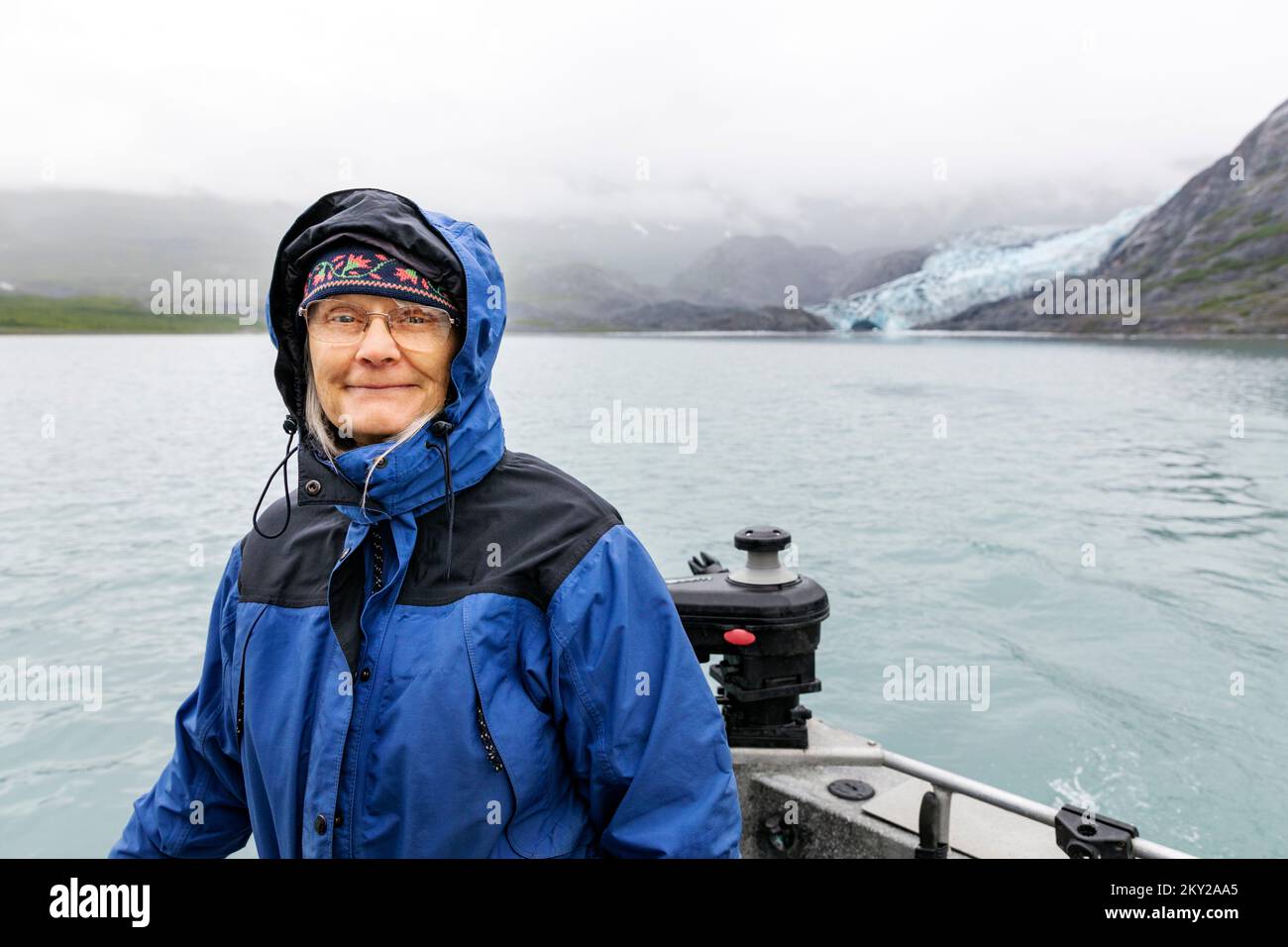 Senior female tourist; charter boat visiting Shoup Glacier; Shoup Bay ...