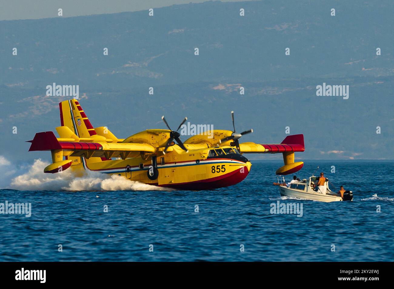 Canadair collects water from the Adriatic Sea in front of Stobrec, near ...