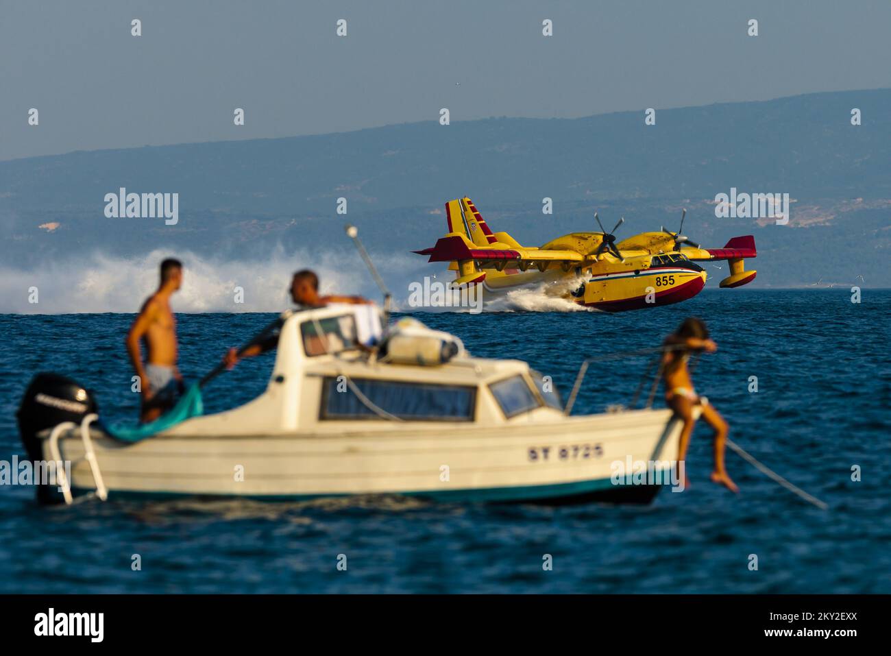 Canadair collects water from the Adriatic Sea in front of Stobrec, near ...