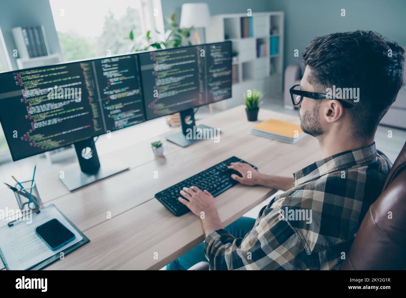 Photo of busy confident guy wear glasses typing keyboard modern device ...