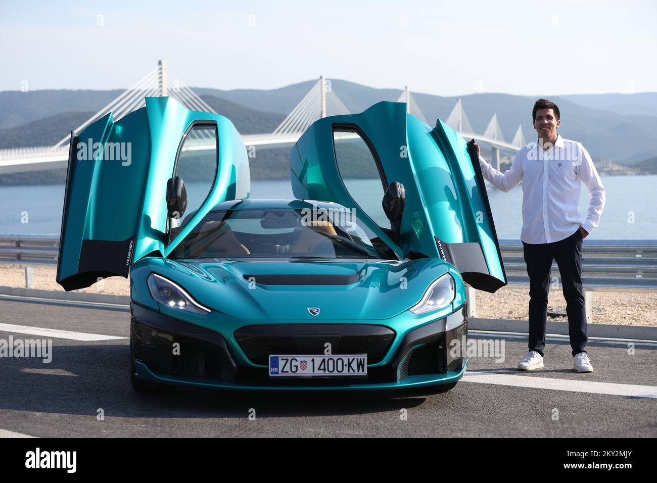 Chief Program Engineer at Rimac Automobili Matija Renic pose next to ...