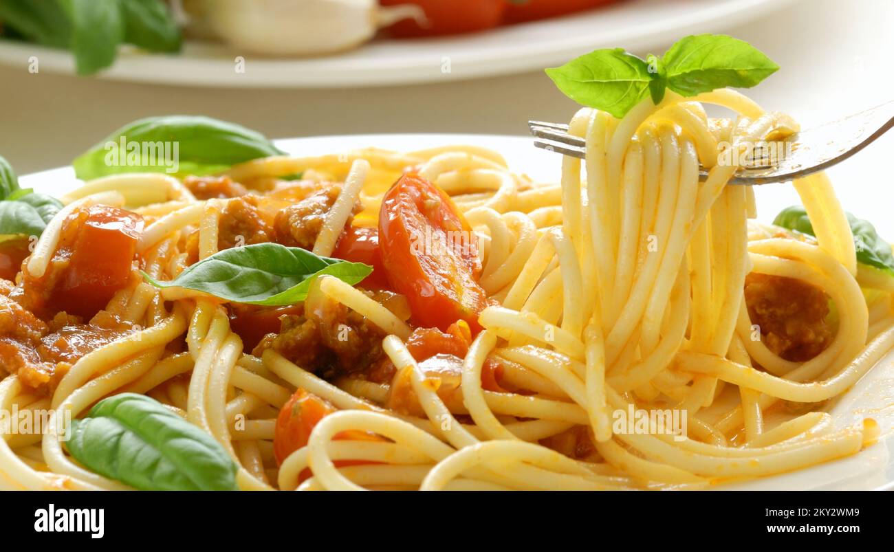 Spaghetti pasta dish with garnish Stock Photo - Alamy