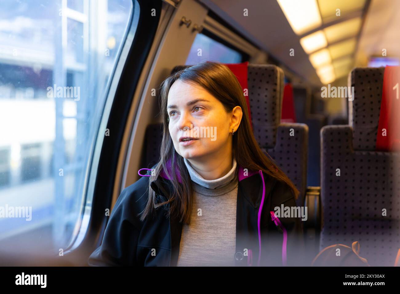 Woman leaving through window hi-res stock photography and images - Alamy