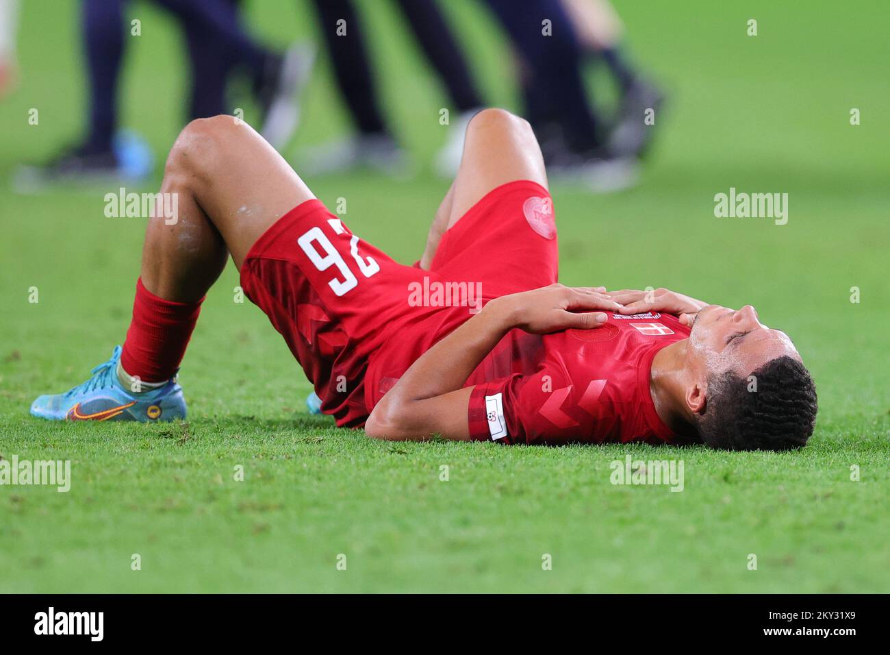 Alexander Bah of Denmark lies on the ground devastated during the FIFA ...