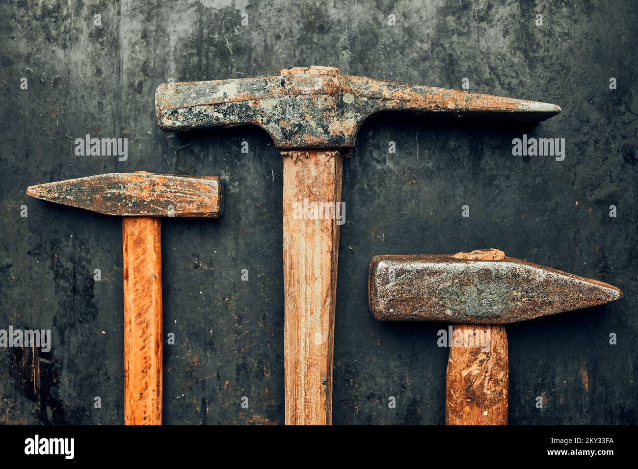 Old hammers on steel surface. Rusty tools for maintenance. Hardware ...