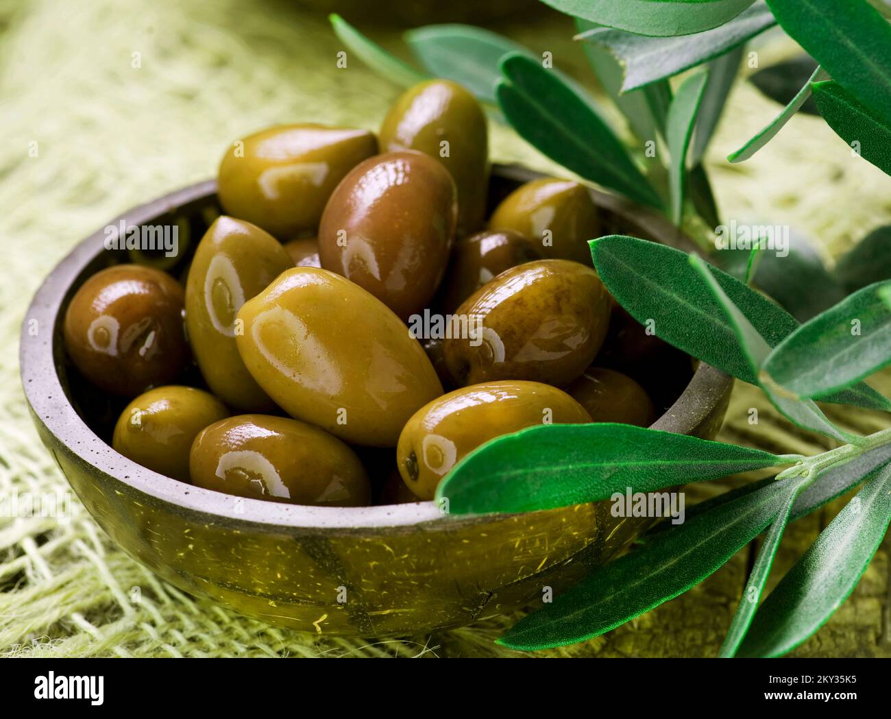 Green olives in a small bowl Stock Photo - Alamy