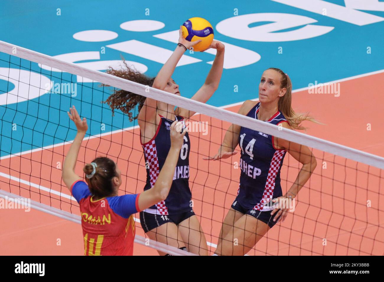 Lea Deak of Croatia sets the ball for a teammate Martina Samadan during ...