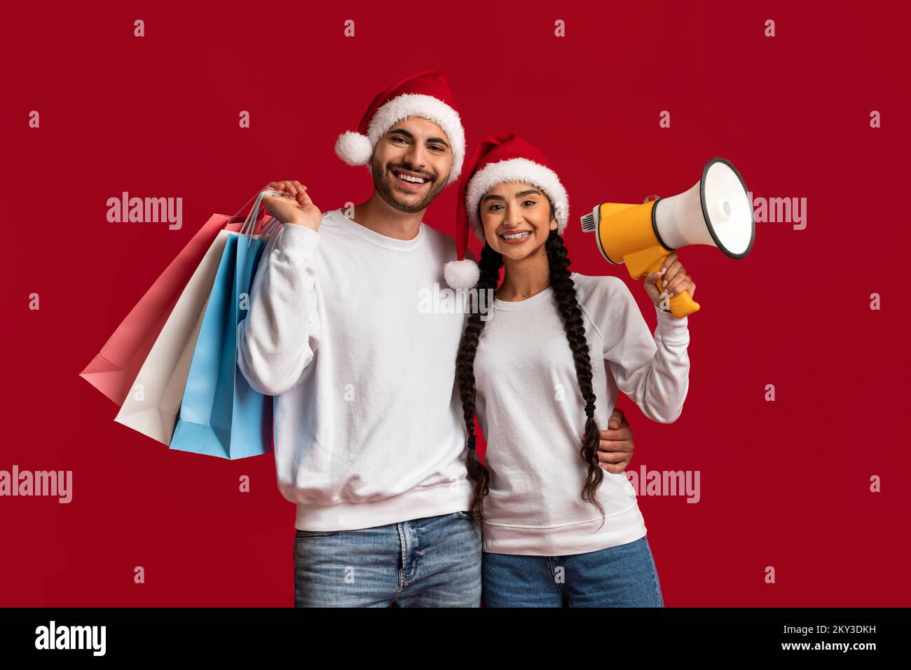 Family couple wearing christmas hats hi-res stock photography and ...