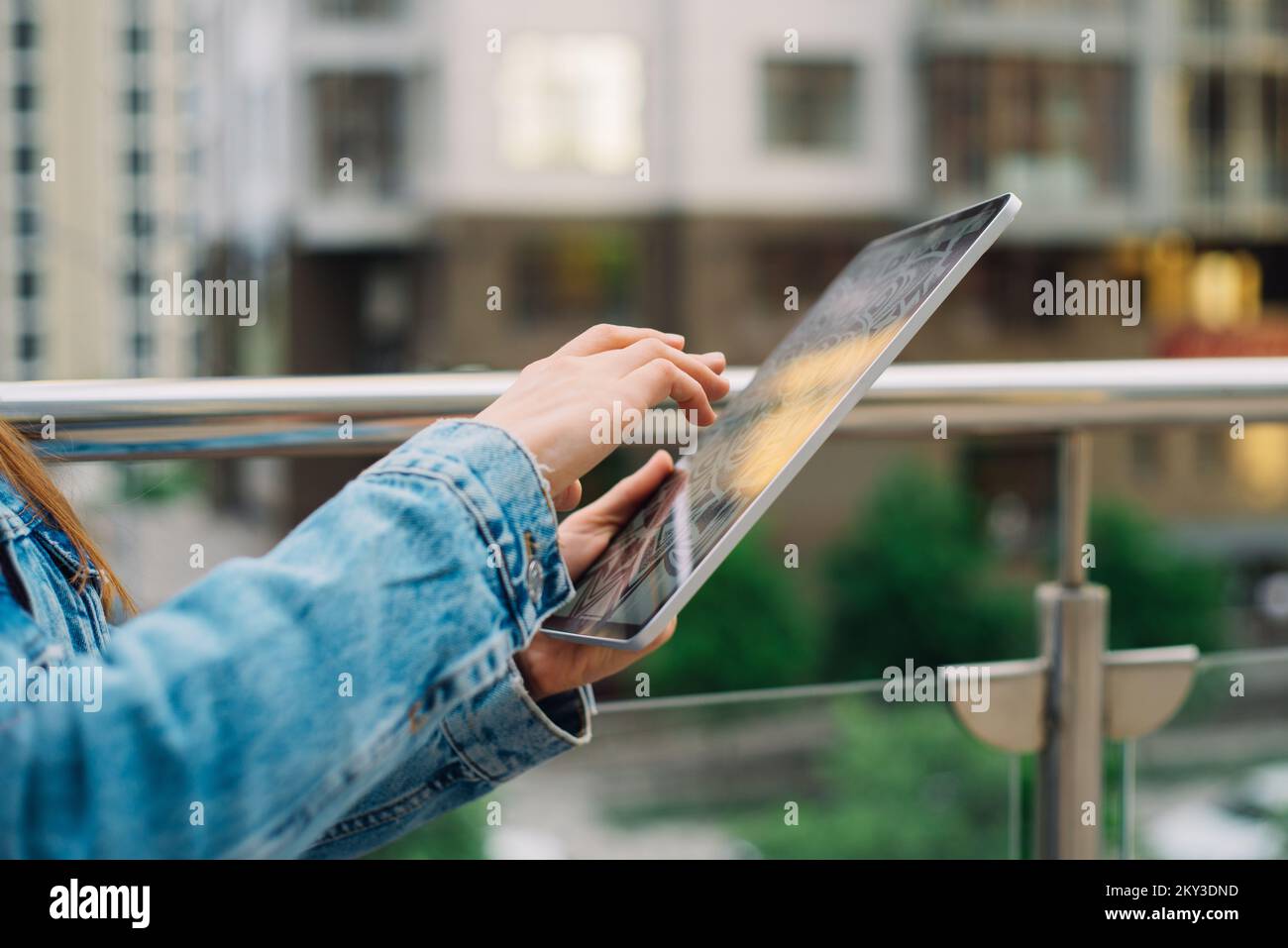 Close-up hand businesswoman using digital tablet while standing ...