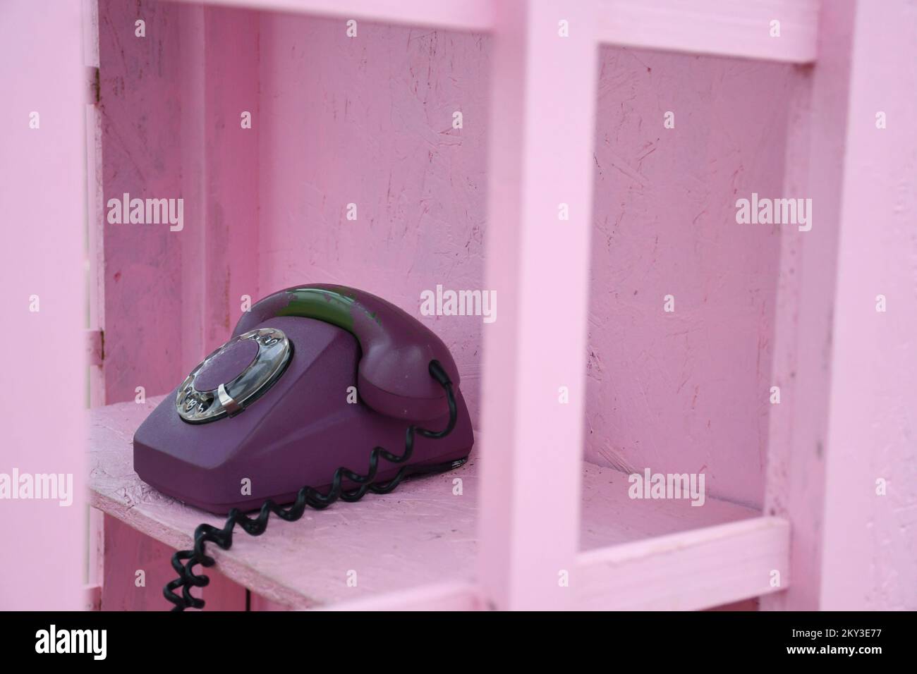 A pink phone booth decorated with flowers adorns the lawn of the newly ...