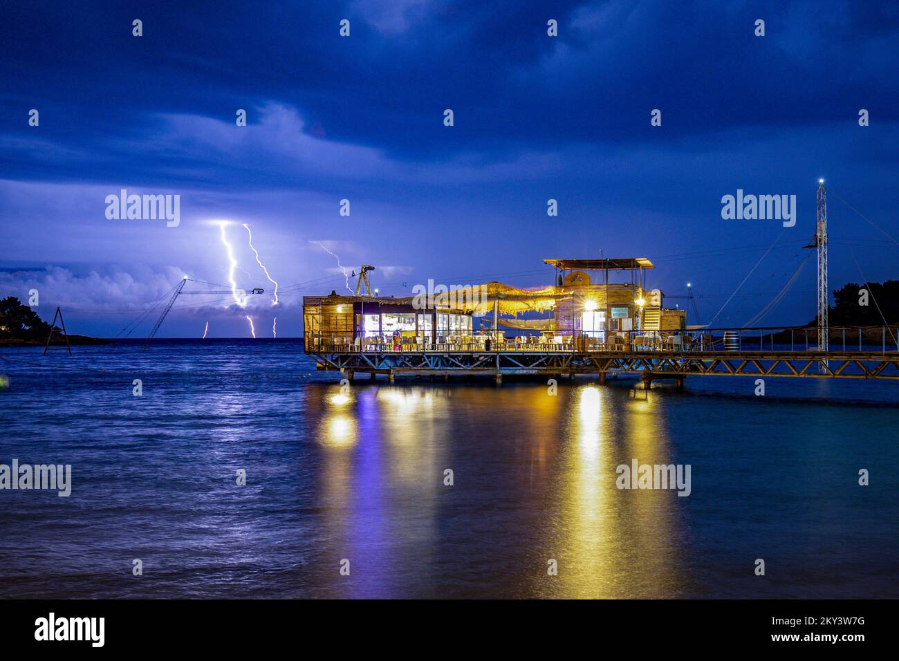Lightning flashed in the sky above the beach bar in Pula, Croatia on ...